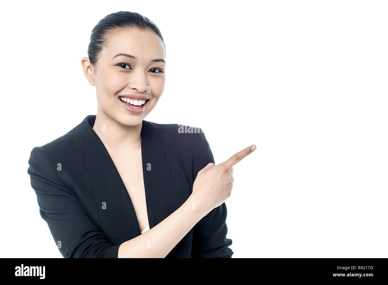 Female executive pointing at something Stock Photo - Alamy