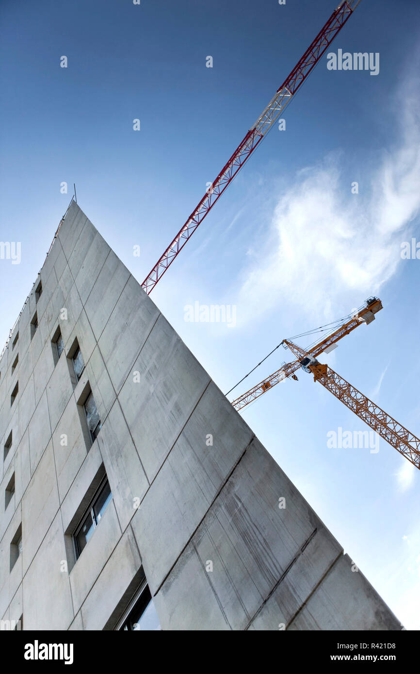 Modern building and cranes Stock Photo - Alamy