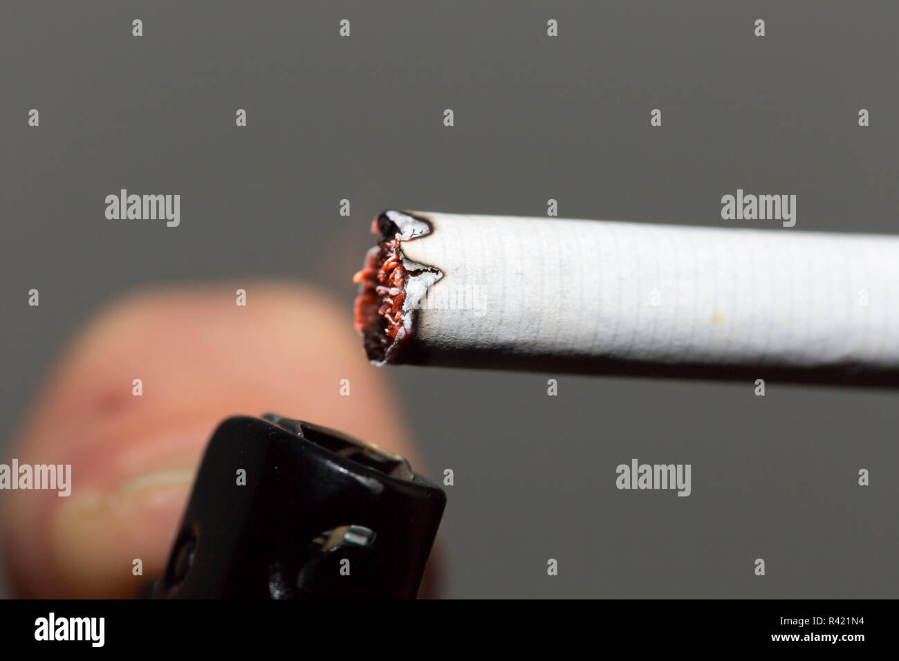 Lighting a Cigarette Stock Photo - Alamy