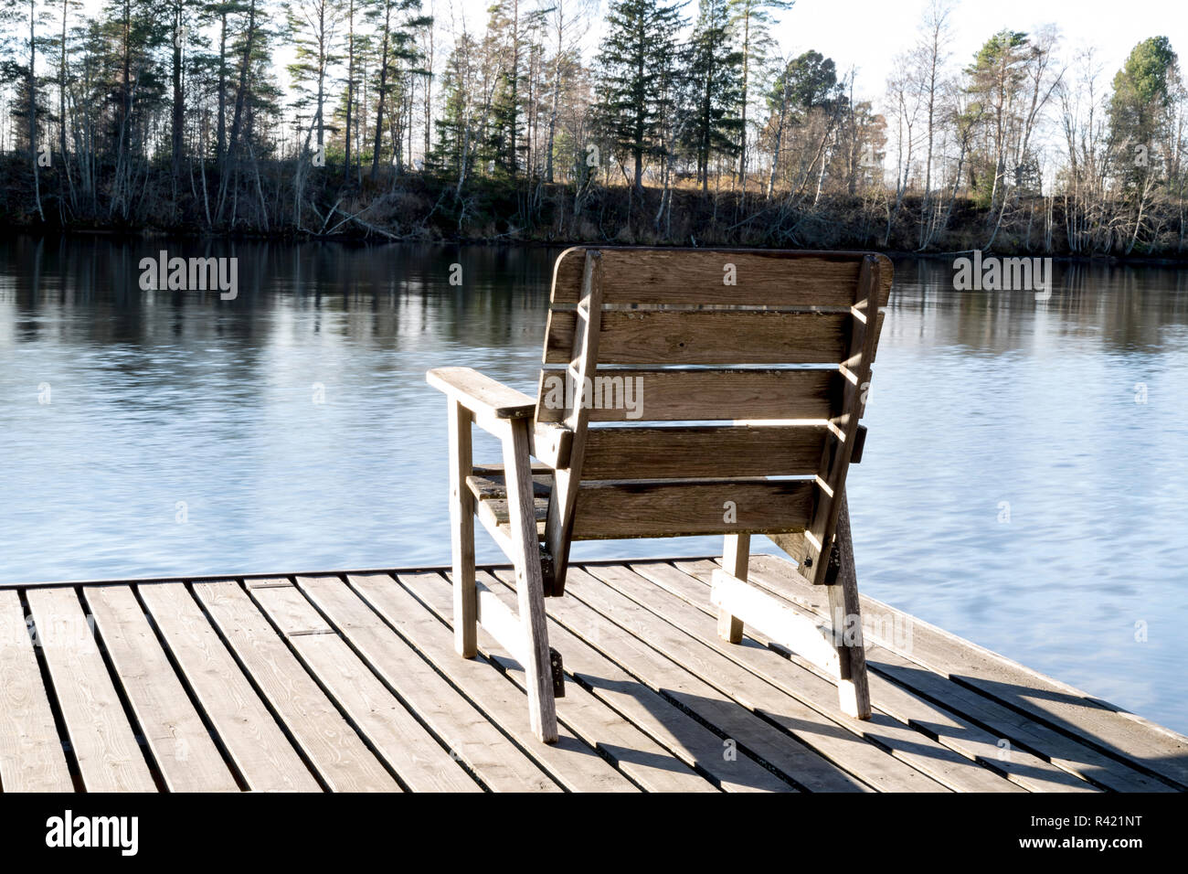 Wooden Chair By River Stock Photo - Alamy