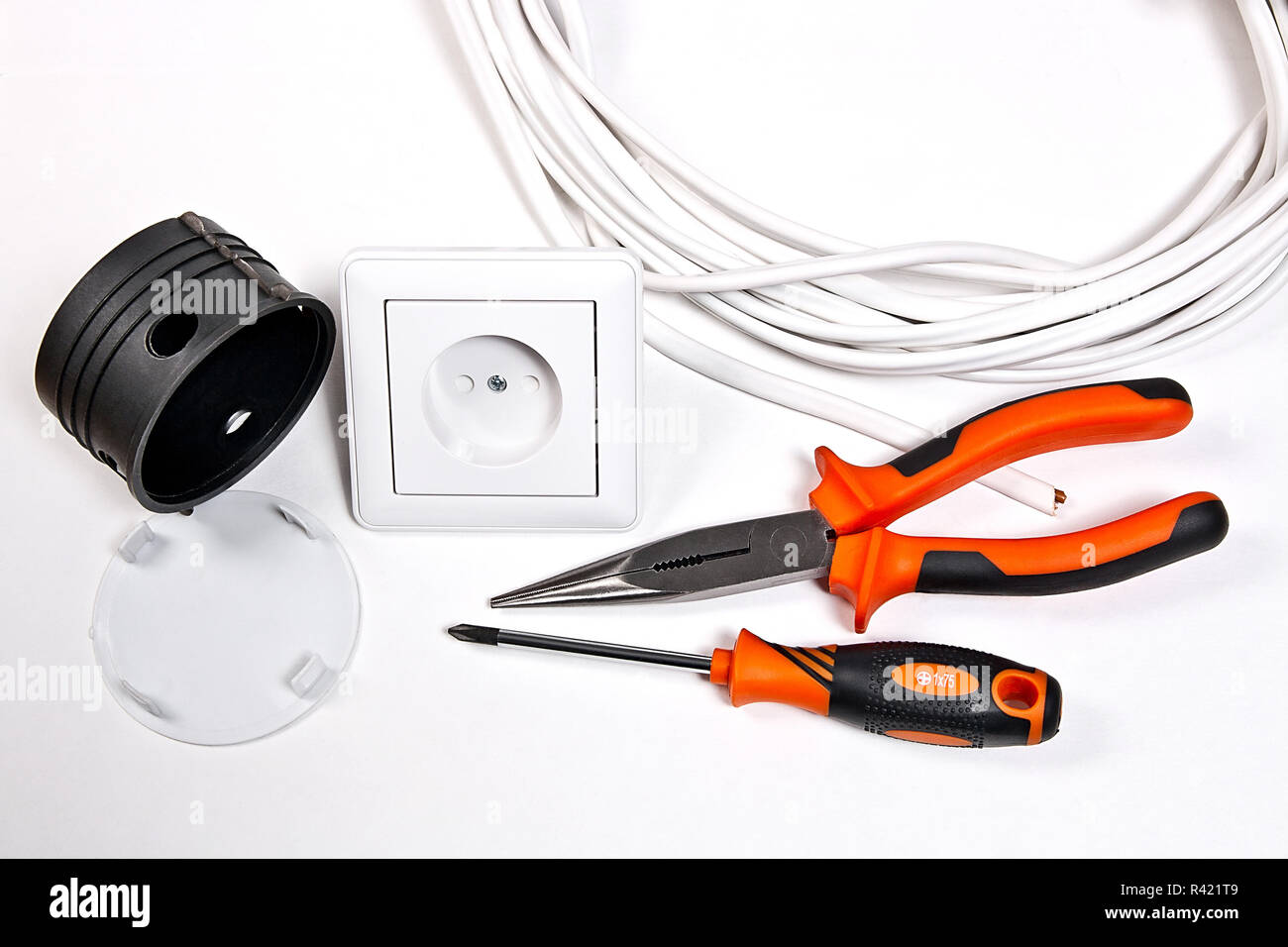 Electrician tools, cable, box for installation of sockets and wall ...