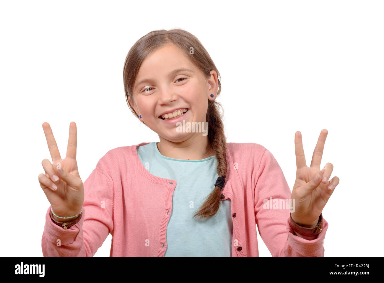 young girl showing her hands by doing victory gesture Stock Photo - Alamy