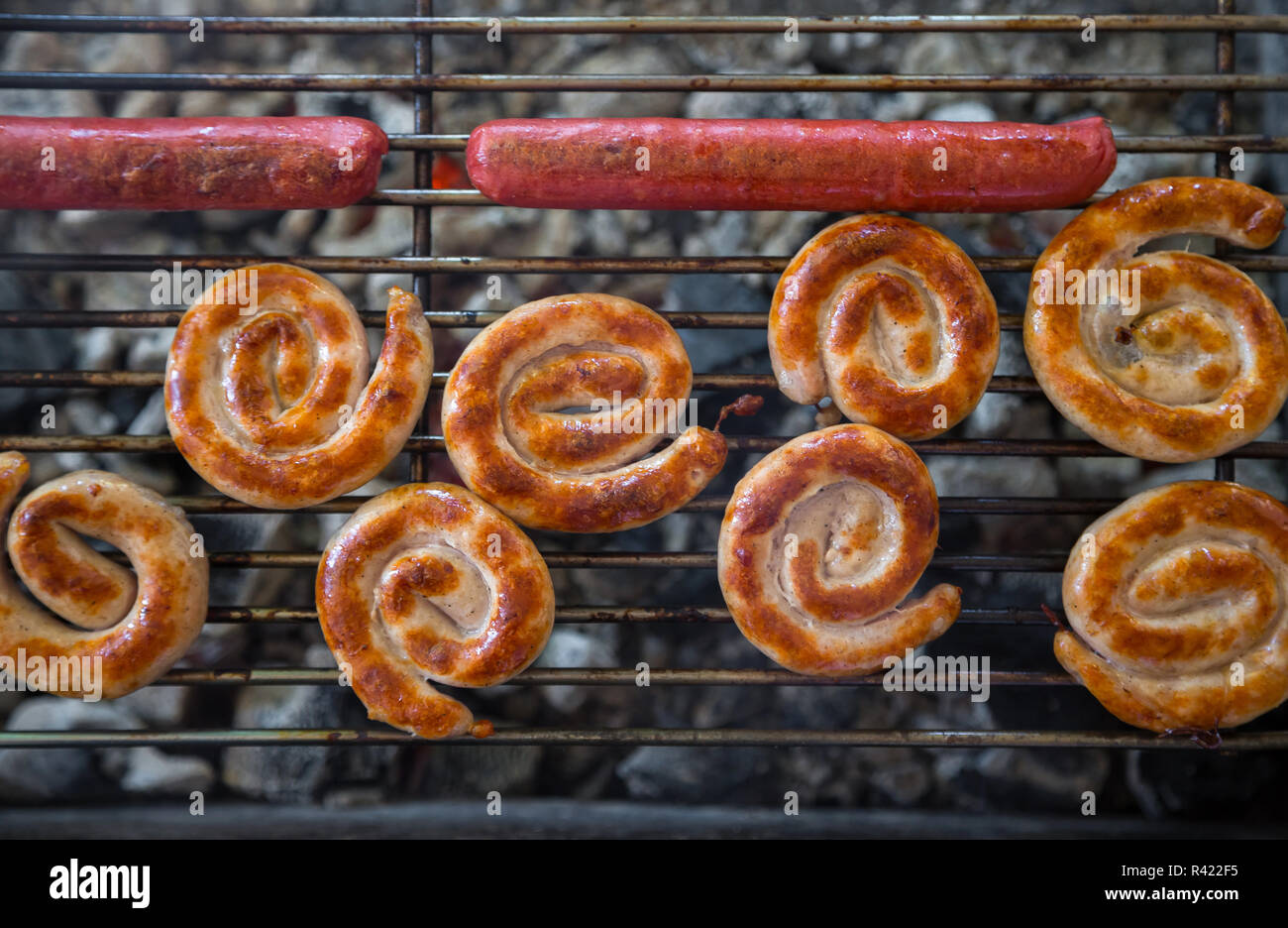 Grilling sausages on barbecue grill Stock Photo - Alamy