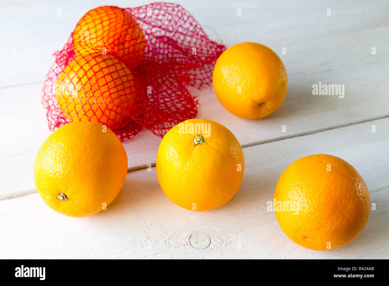 oranges on the net Stock Photo - Alamy