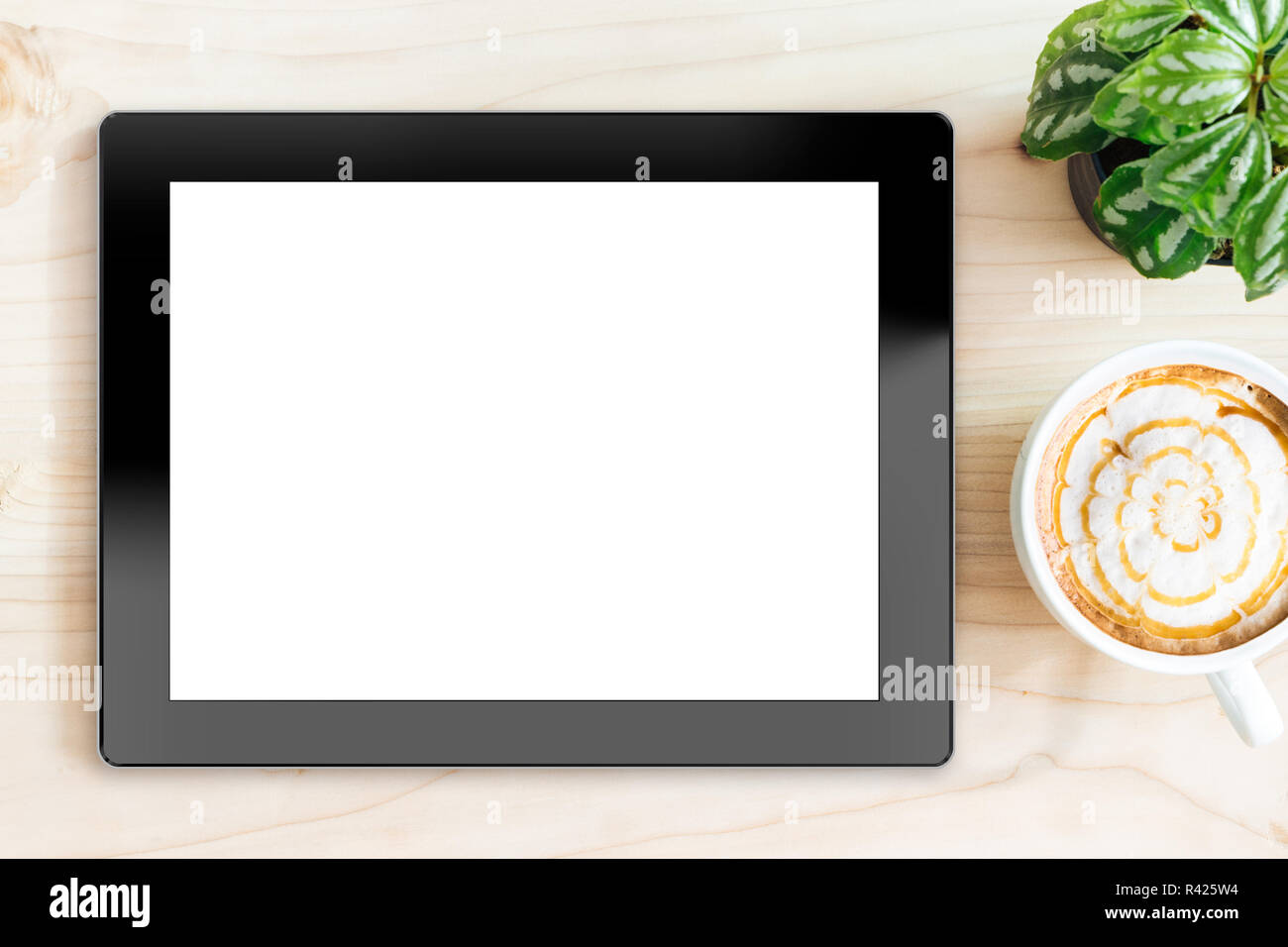 tablet white screen on wood desk on top view Stock Photo - Alamy