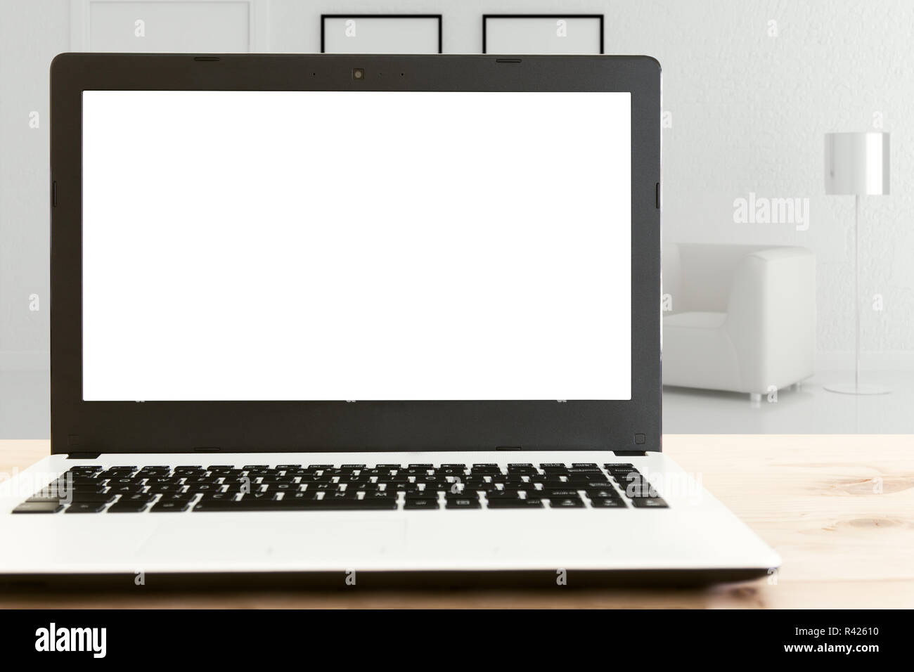 laptop white screen on wood desk Stock Photo - Alamy