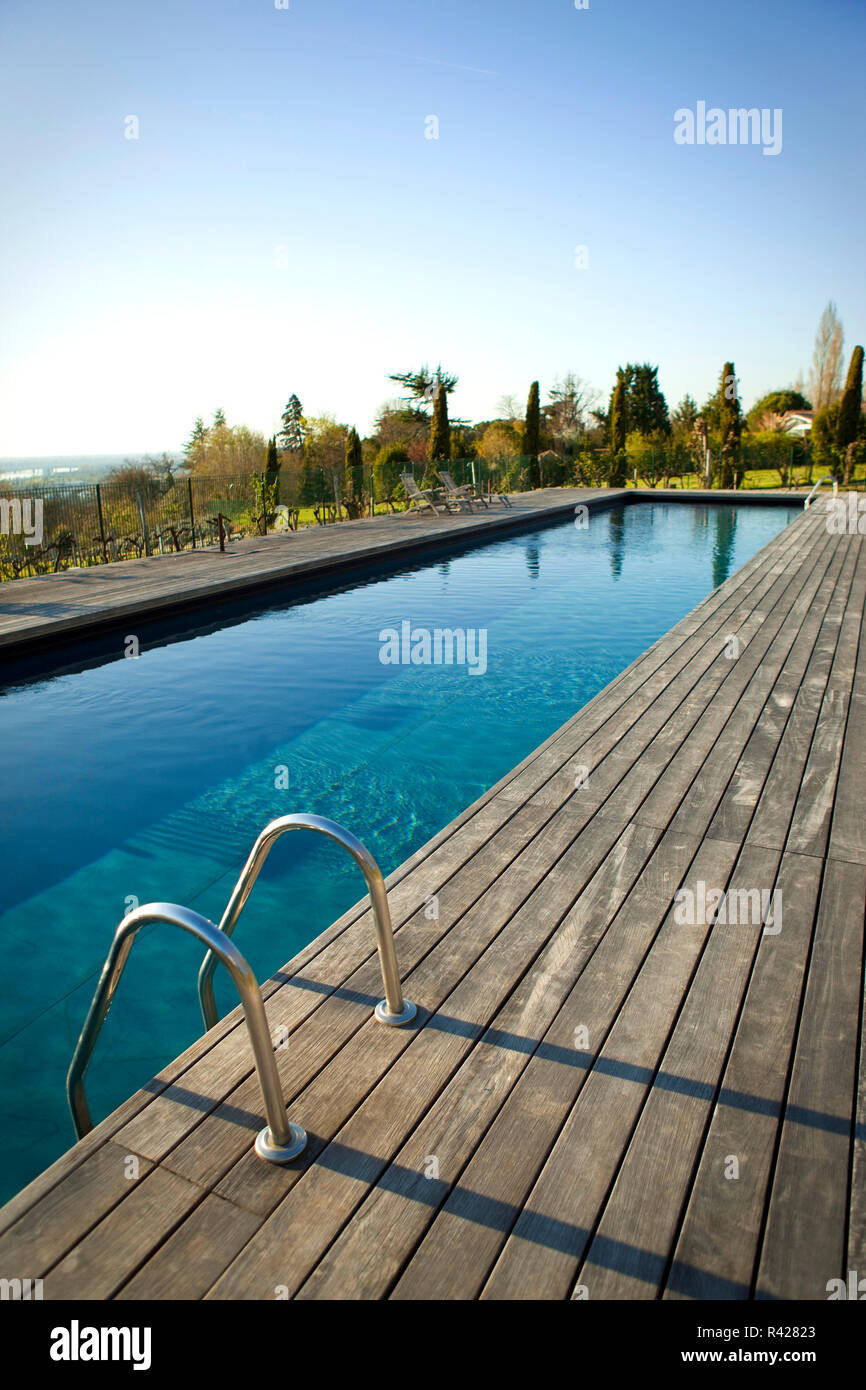 Swimming pool in a French garden Stock Photo - Alamy