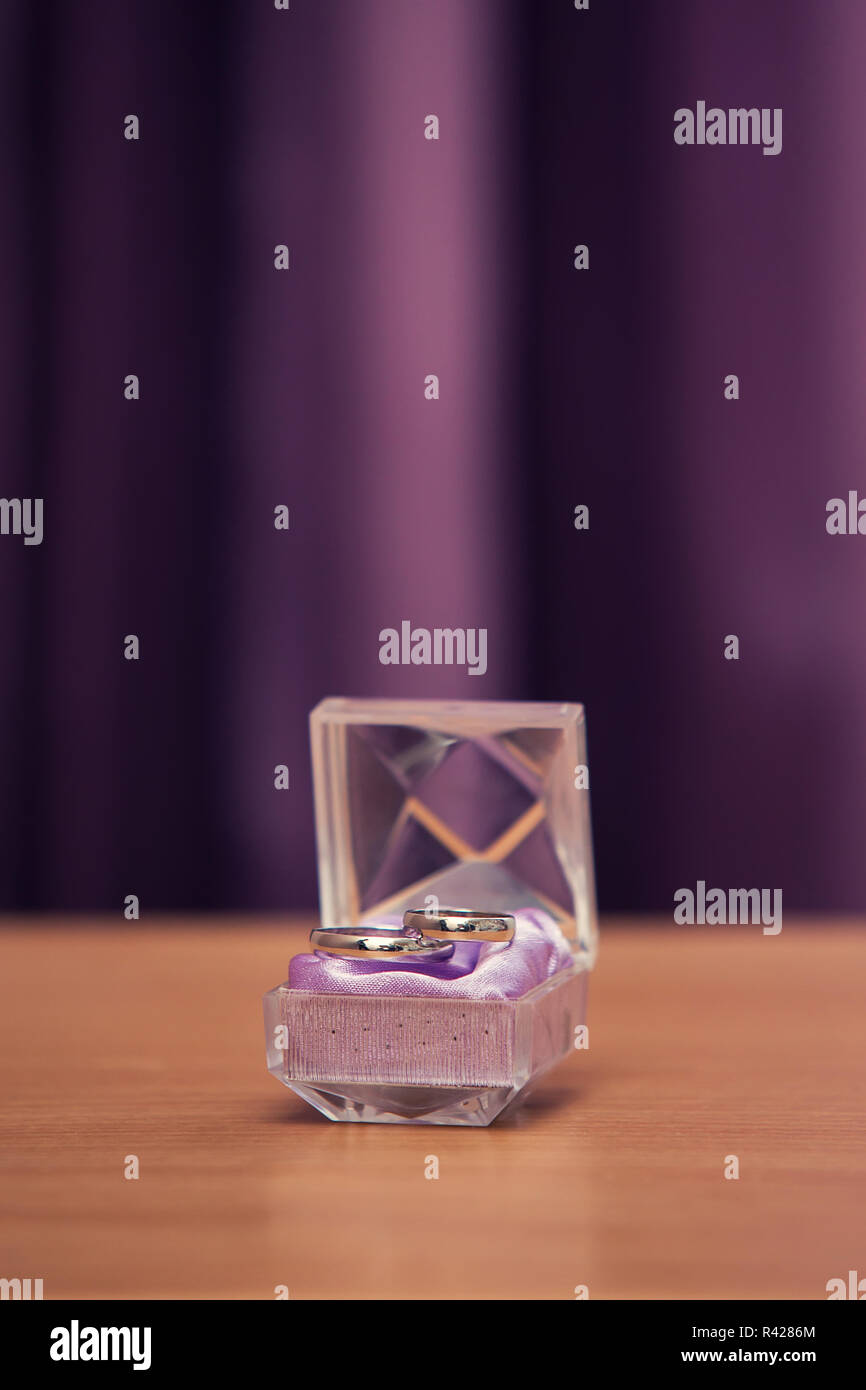 Wedding rings in the violet box Stock Photo - Alamy