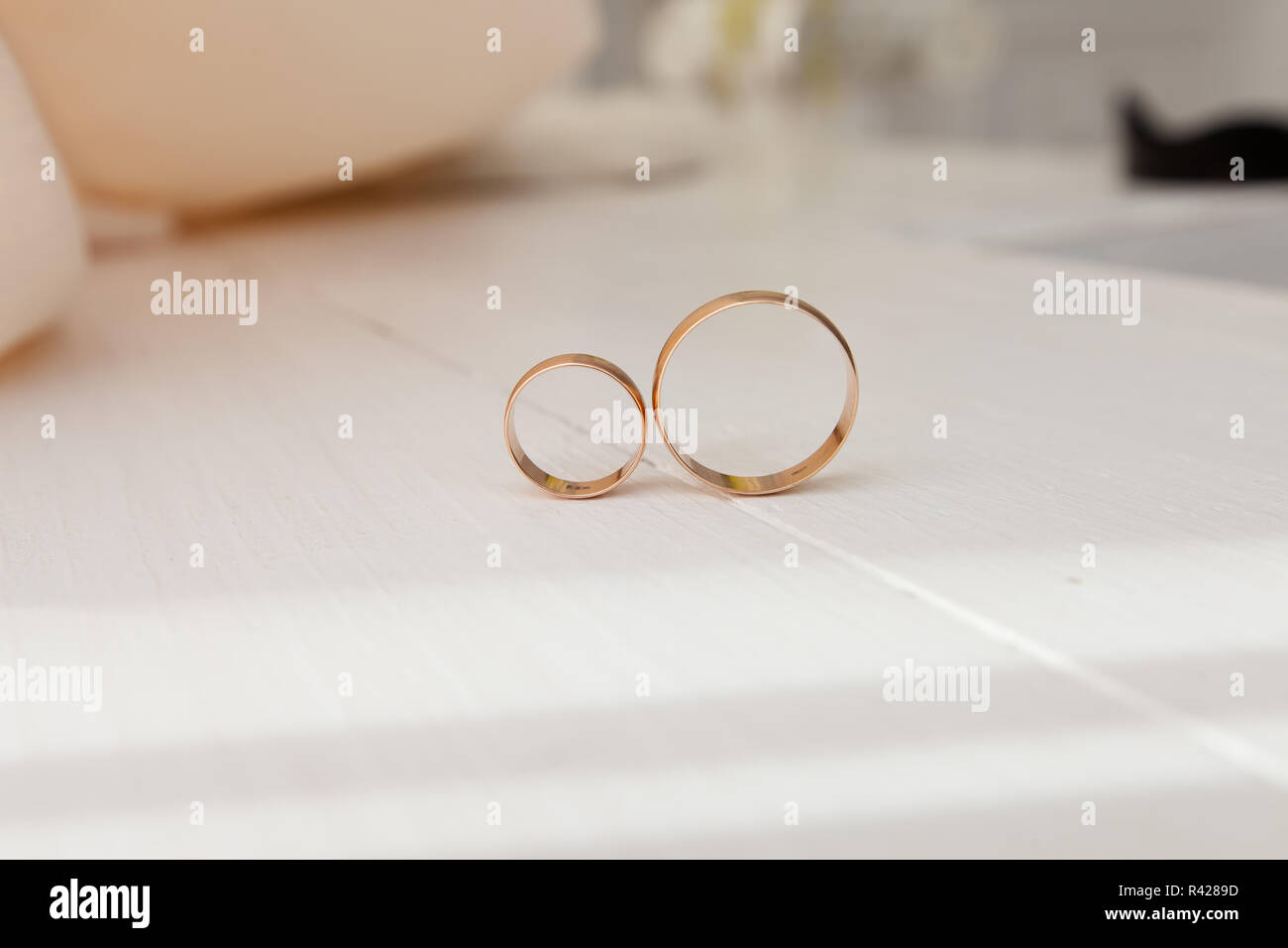 Wedding rings on the table Stock Photo - Alamy