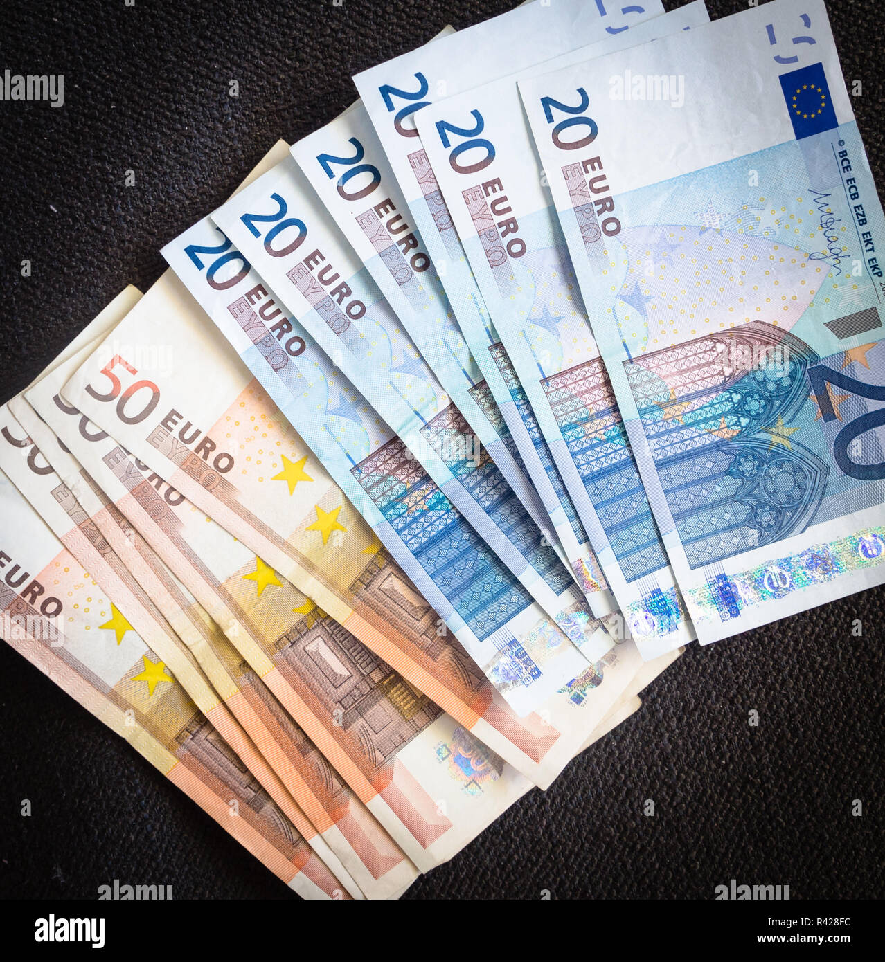 Euros with dark background Stock Photo - Alamy