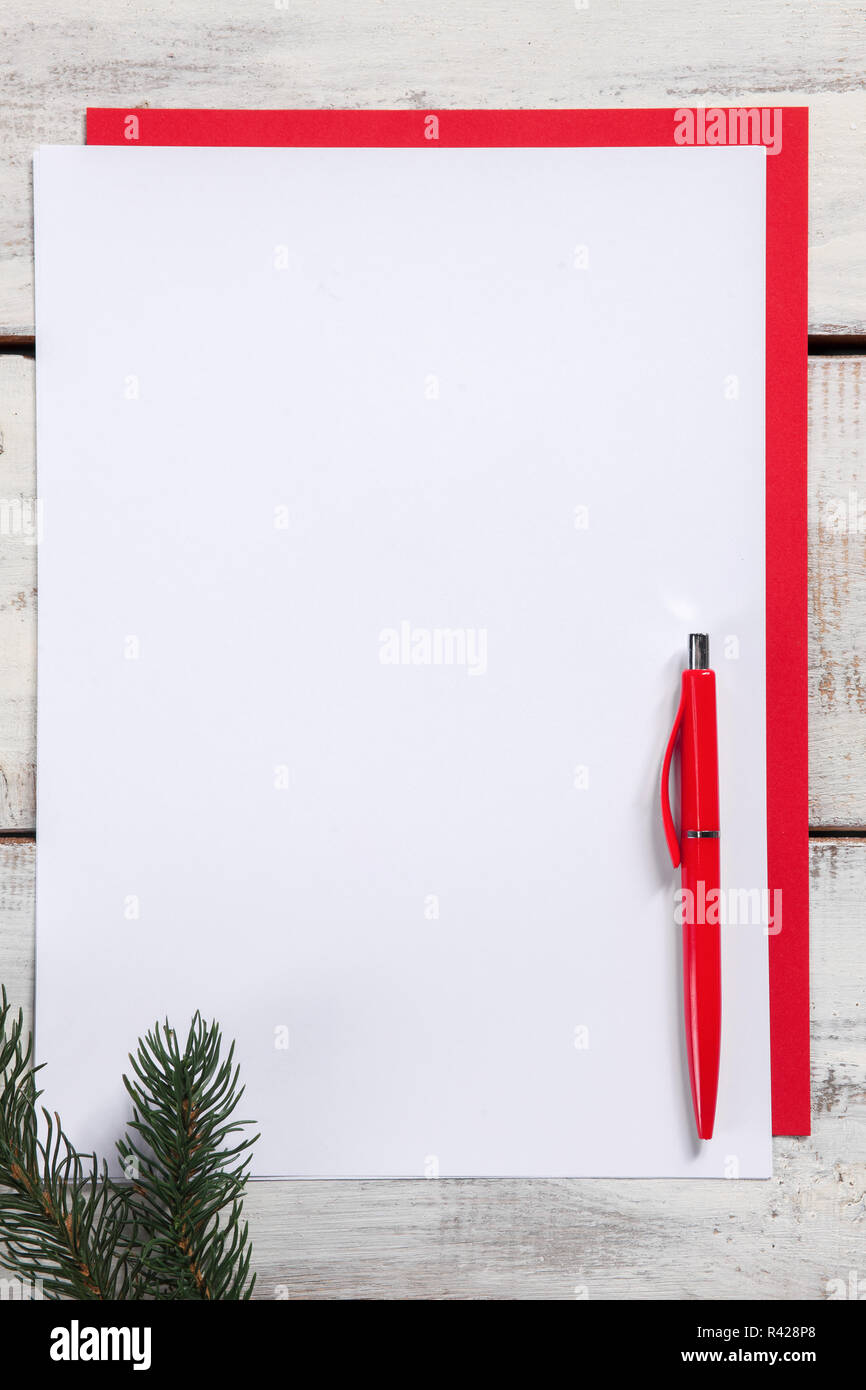 The blank sheet of paper on the wooden table with a pen Stock Photo - Alamy