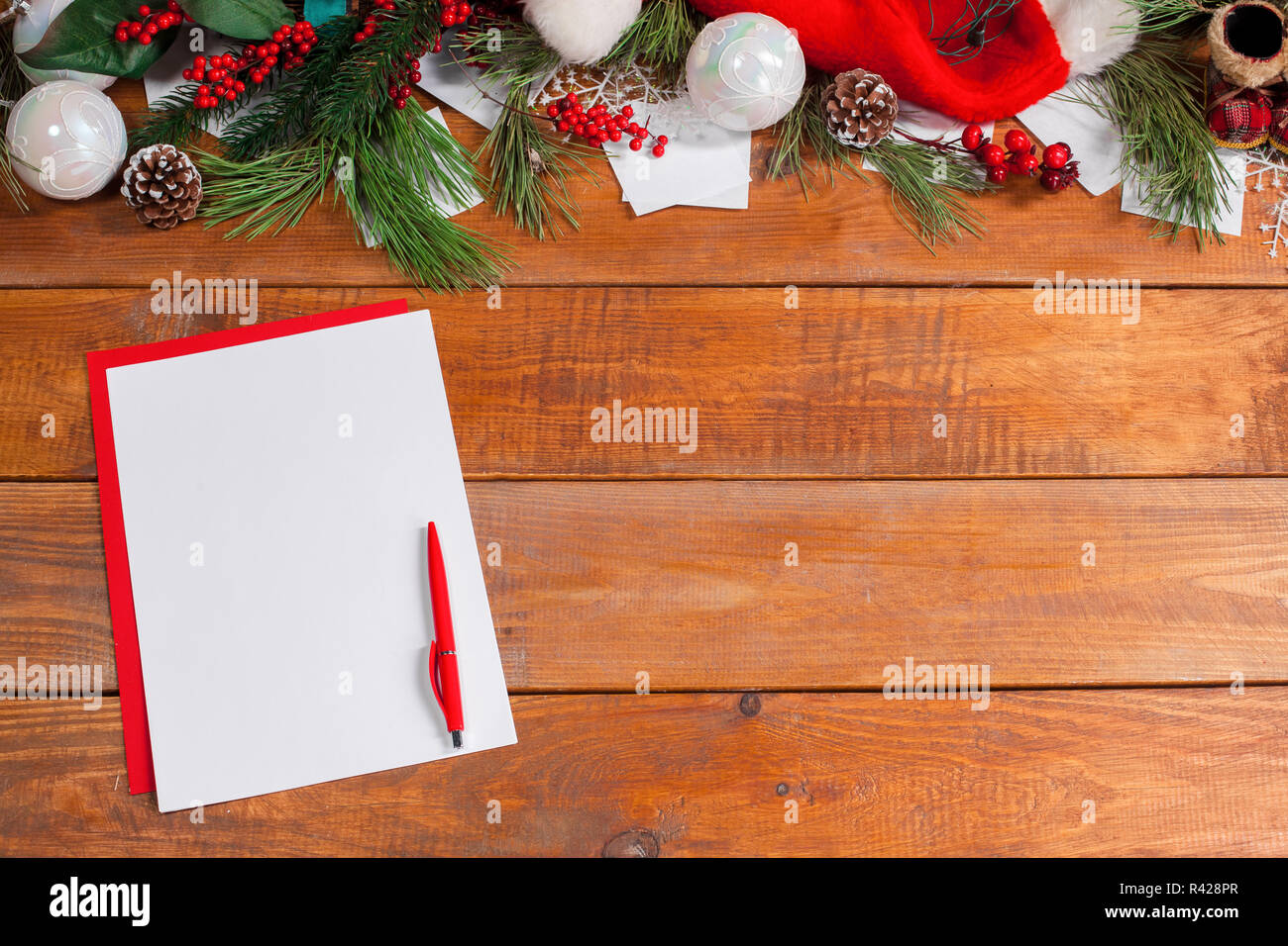 The blank sheet of paper on the wooden table with a pen Stock Photo - Alamy