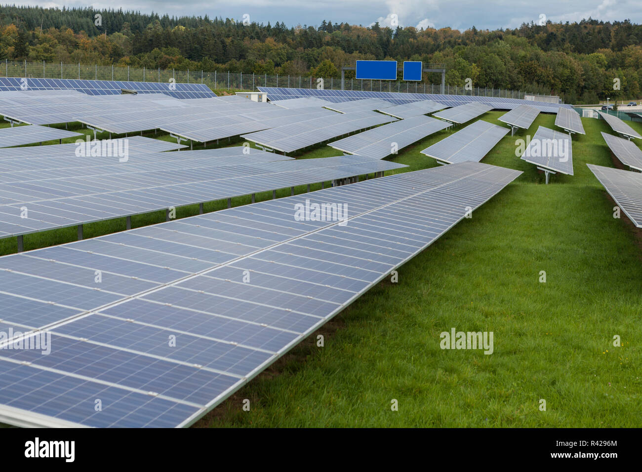 meadow solar cells in a solar farm on green Stock Photo - Alamy