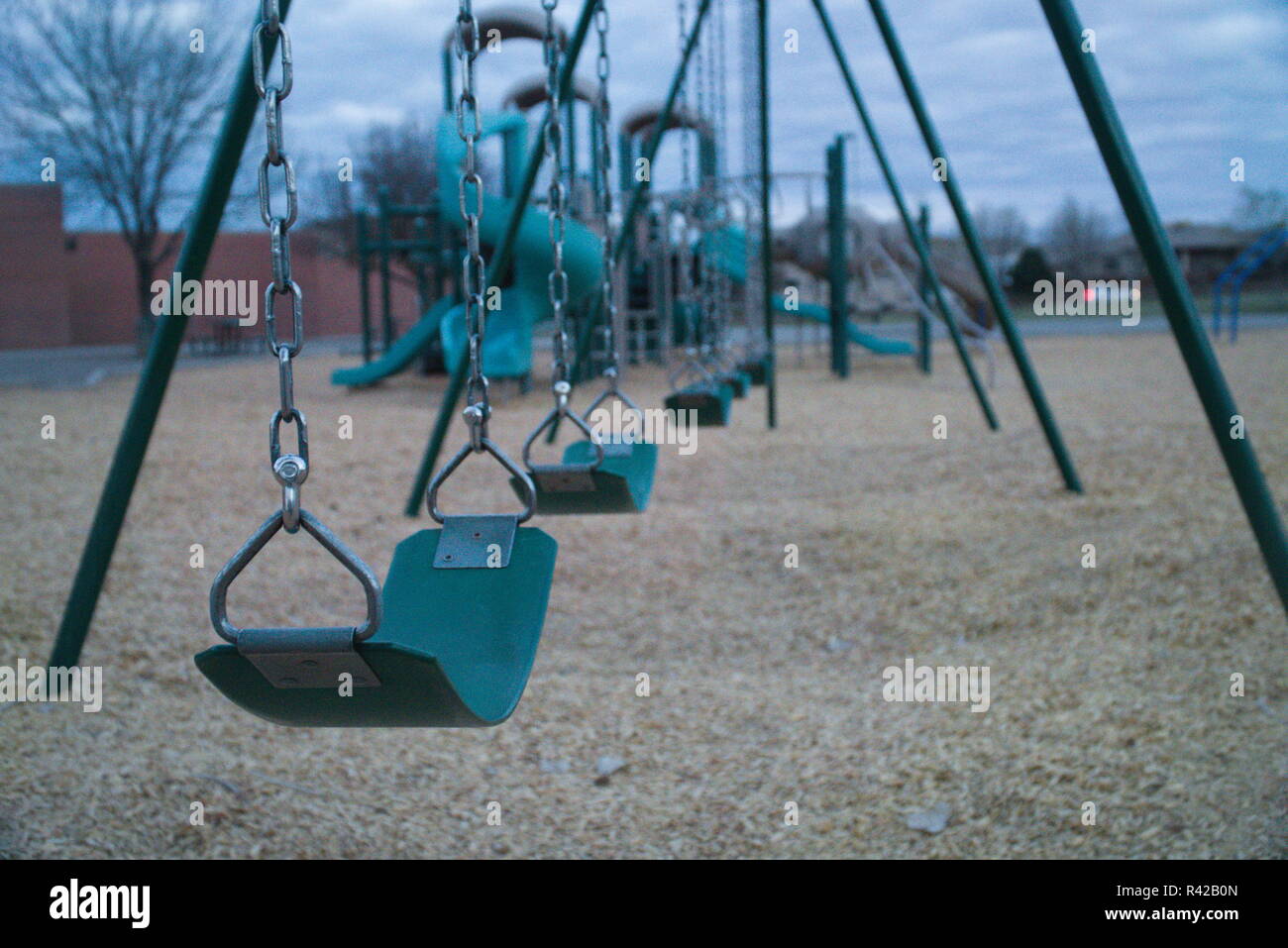 Swings playground hi-res stock photography and images - Alamy