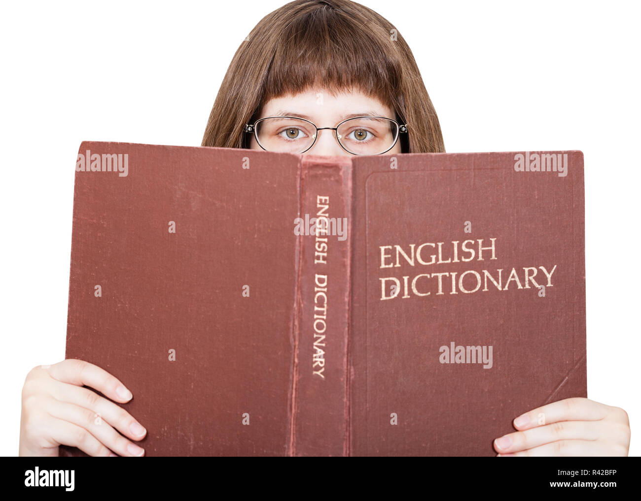 girl looks over English Dictionary book isolated Stock Photo - Alamy