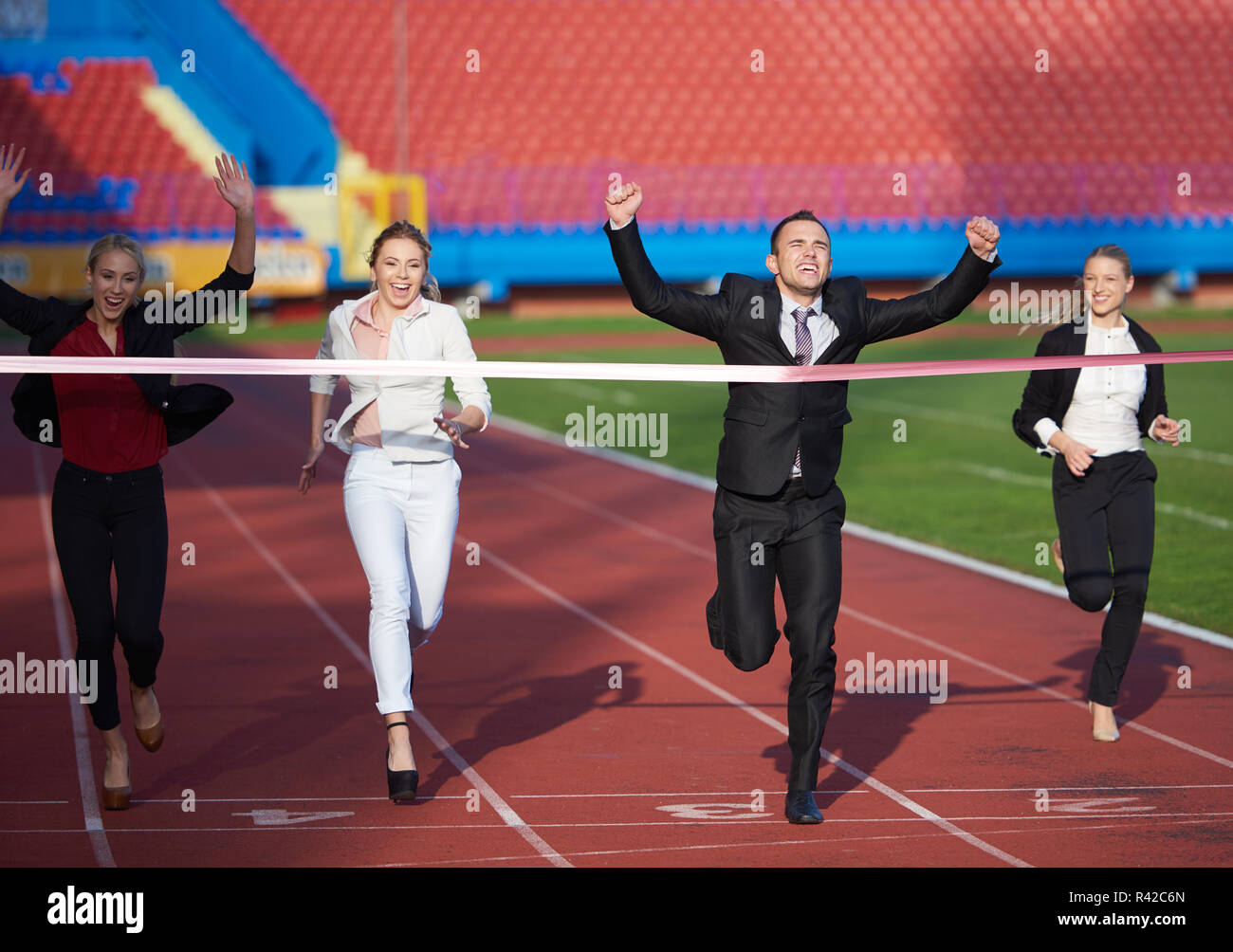business people running on racing track Stock Photo - Alamy