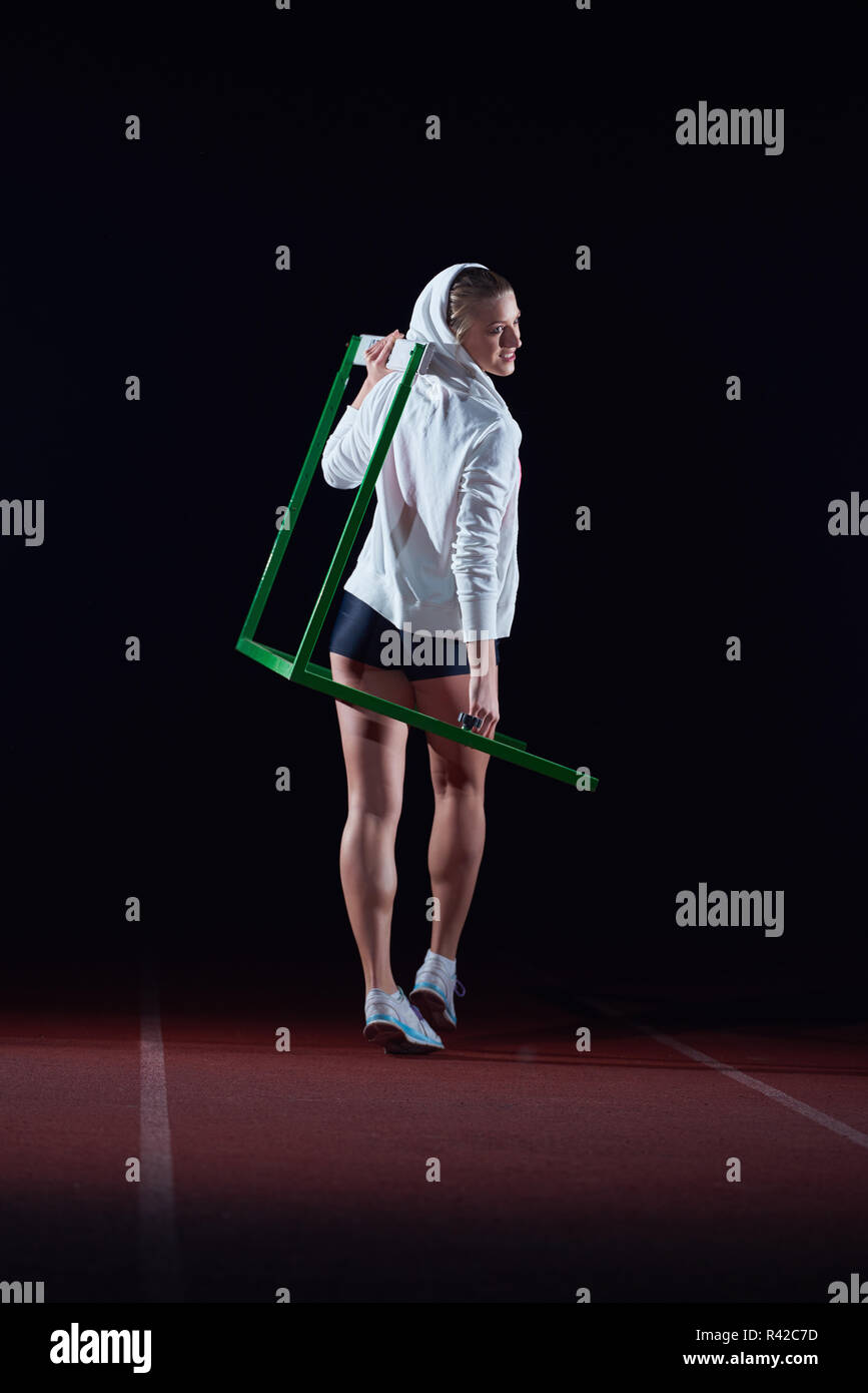 woman athlete jumping over a hurdles Stock Photo - Alamy