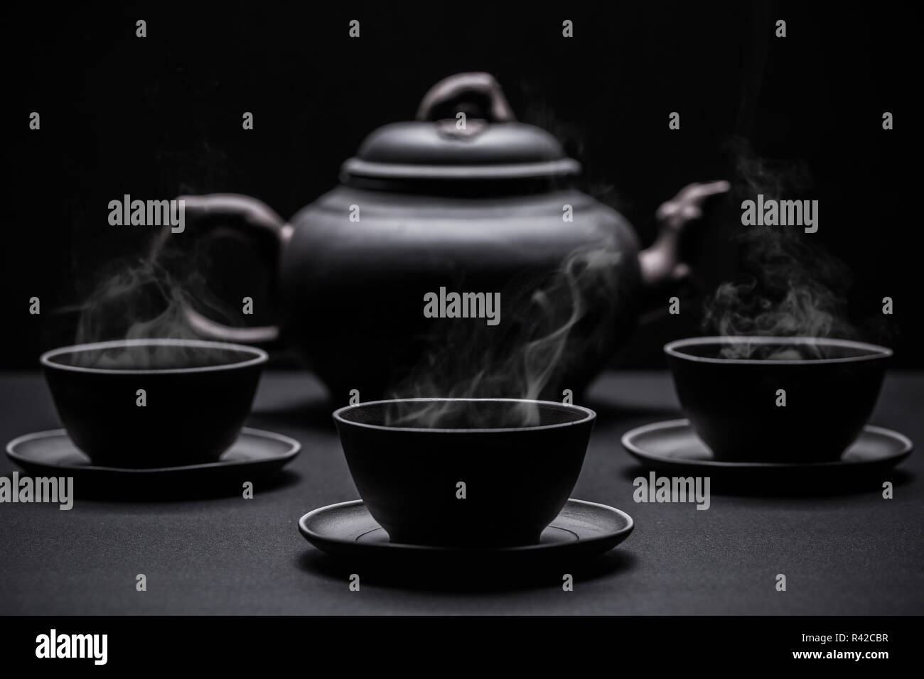 Little black tea cups Stock Photo - Alamy