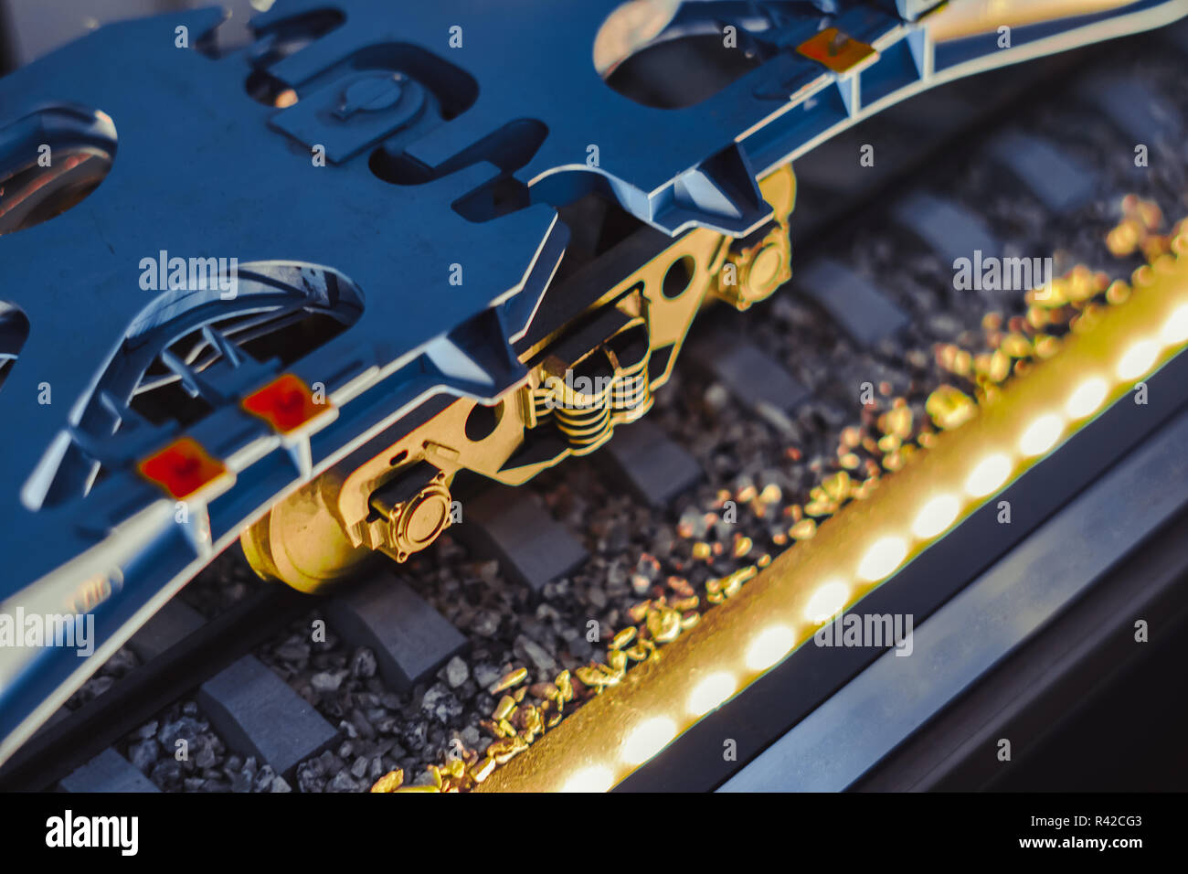 Miniature toy model of modern train crossing bridge Stock Photo - Alamy