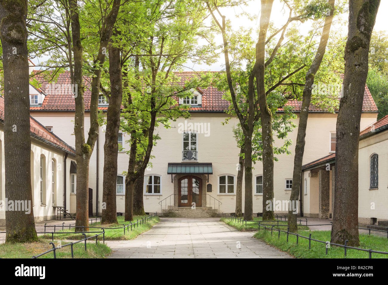 Traditional pastoral Catholic church backyard in European city Stock ...
