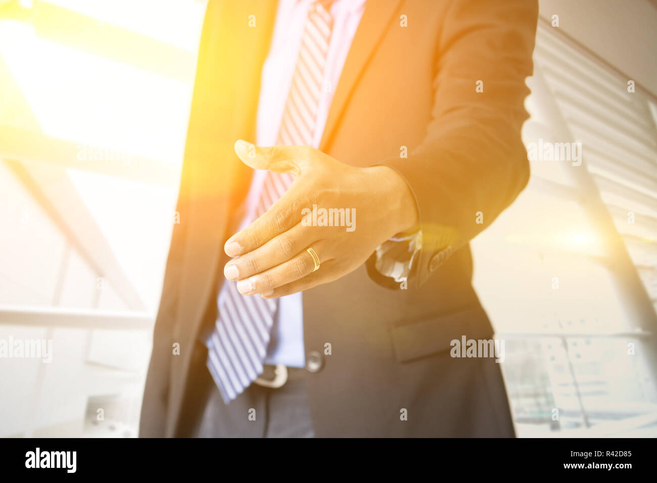 Business people hand offering handshake Stock Photo - Alamy