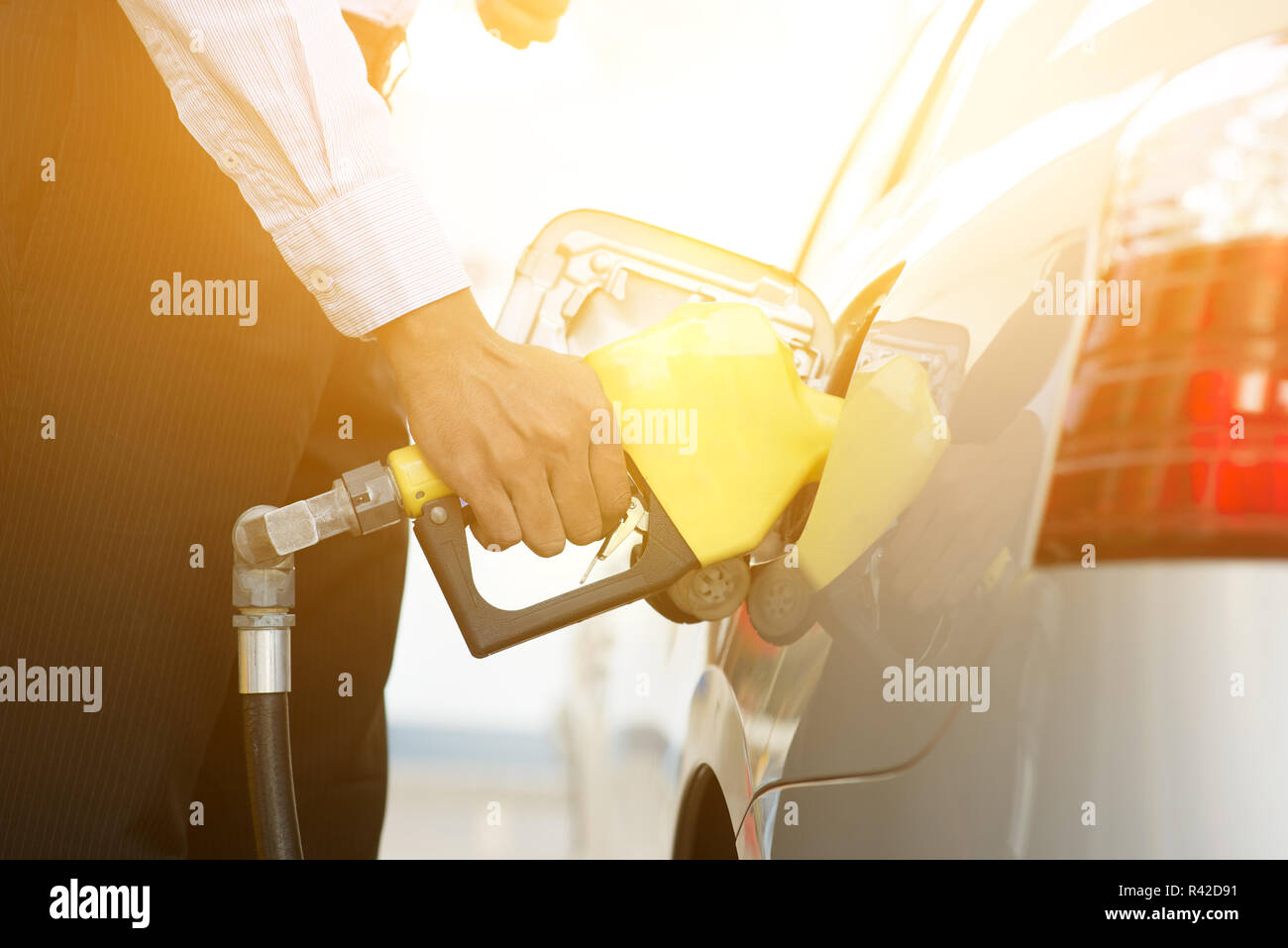 Pumping gasoline fuel Stock Photo - Alamy