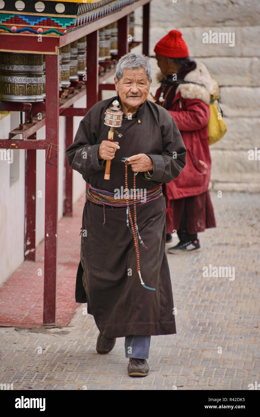Ladakhi pilgrim spinning prayer wheels, Leh, Ladakh, India Stock Photo ...