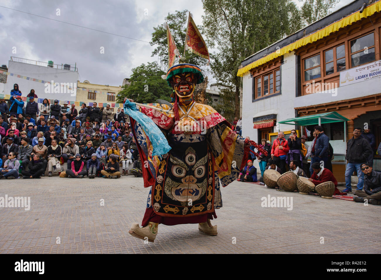 A masked monk performs at a traditional cham Tibetan Buddhist dance ...