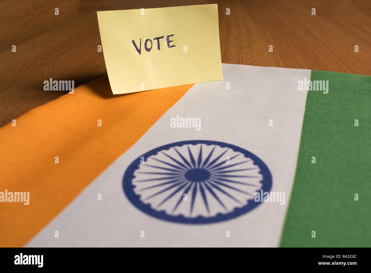 Voting concept - Hand Written Voting Sticker on Indian Flag Stock Photo ...