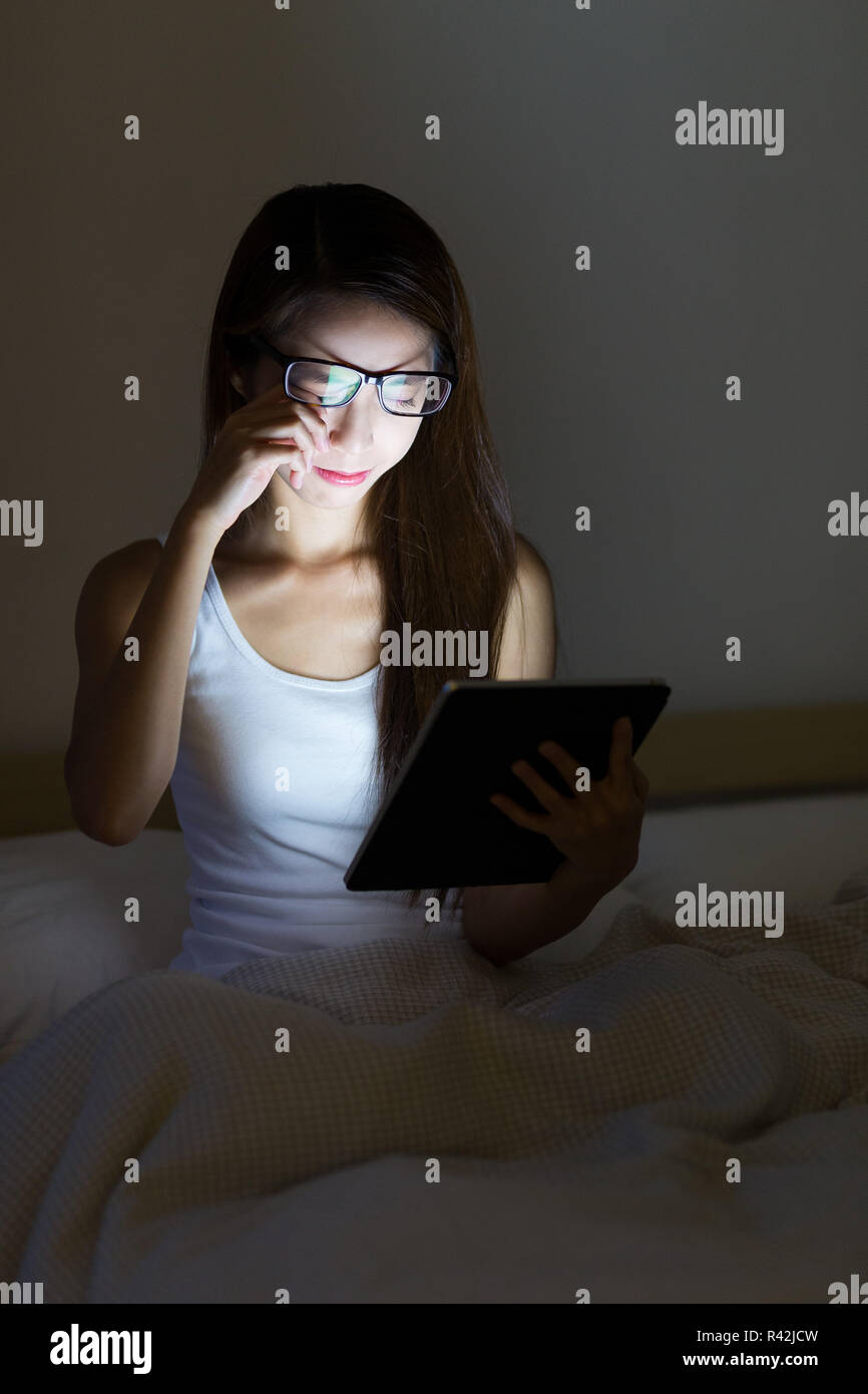 Woman using laptop computer and suffer from eye pain Stock Photo - Alamy