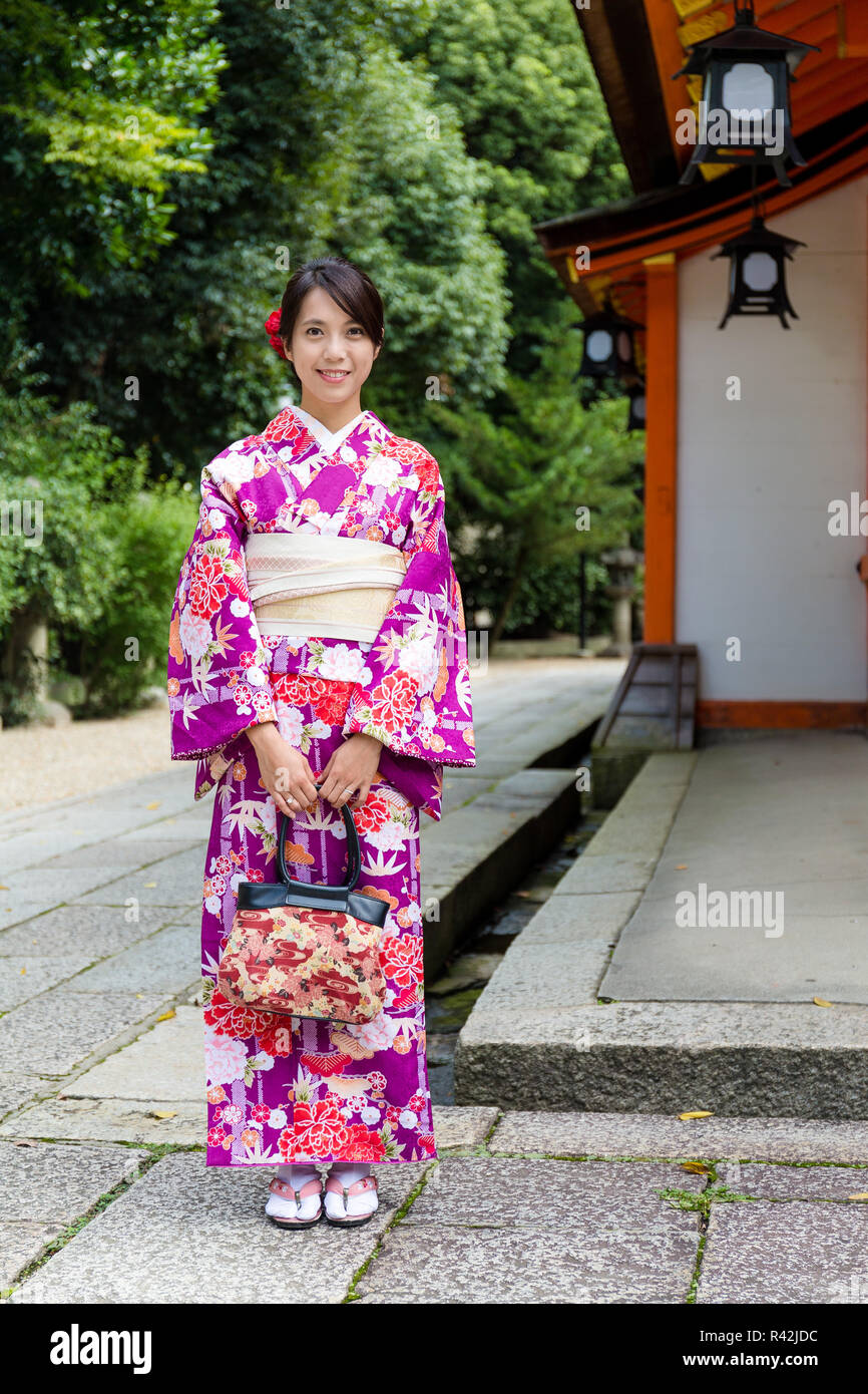 Young woman with Japanese costume at Temple Stock Photo - Alamy