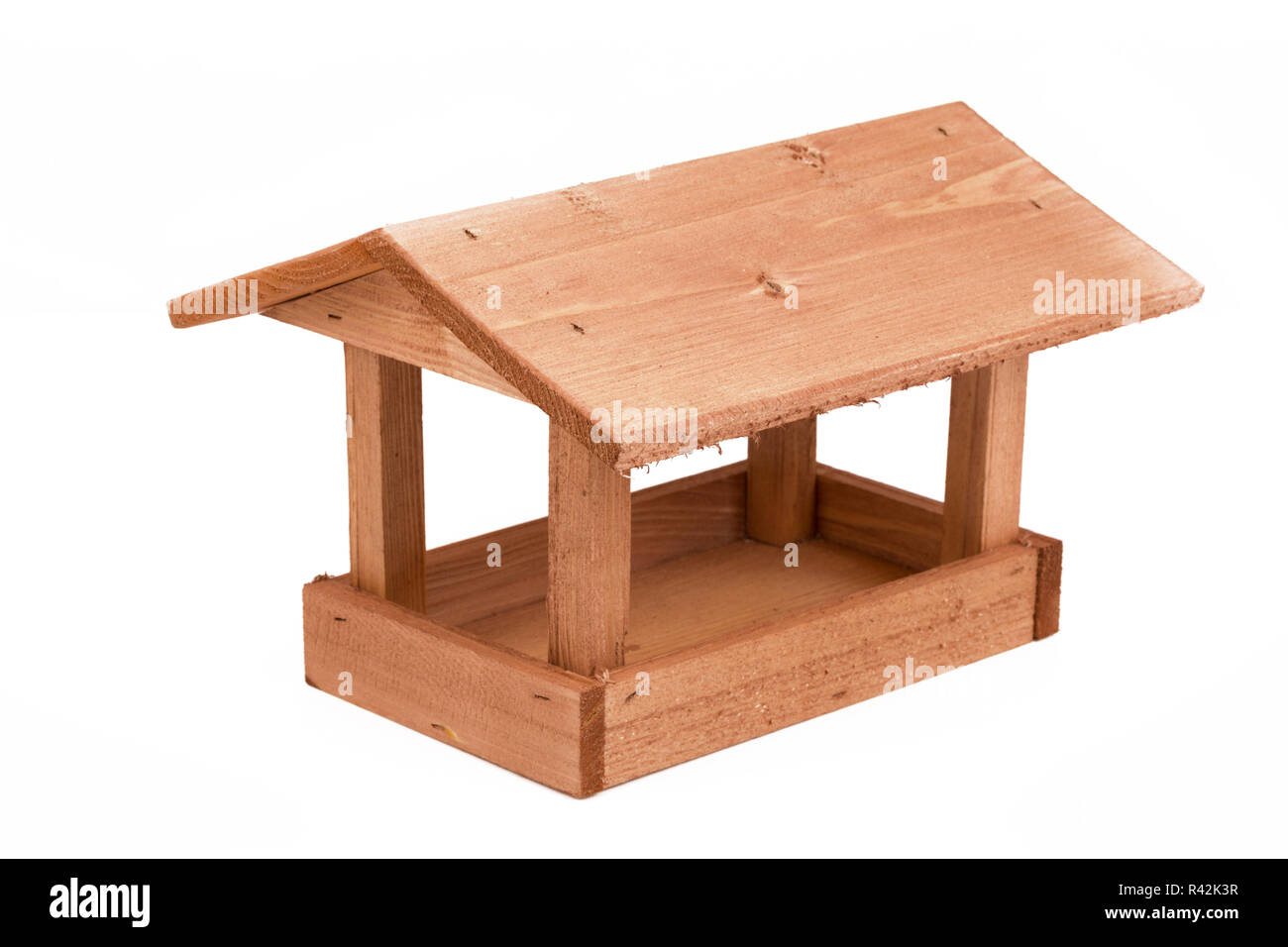 Bird on winter feeder Cut Out Stock Images & Pictures - Alamy