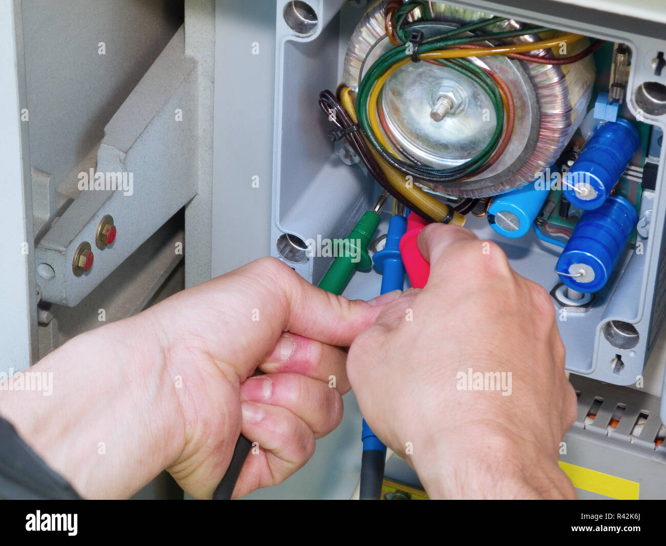 Electrician hands test electrical current hi-res stock photography and ...