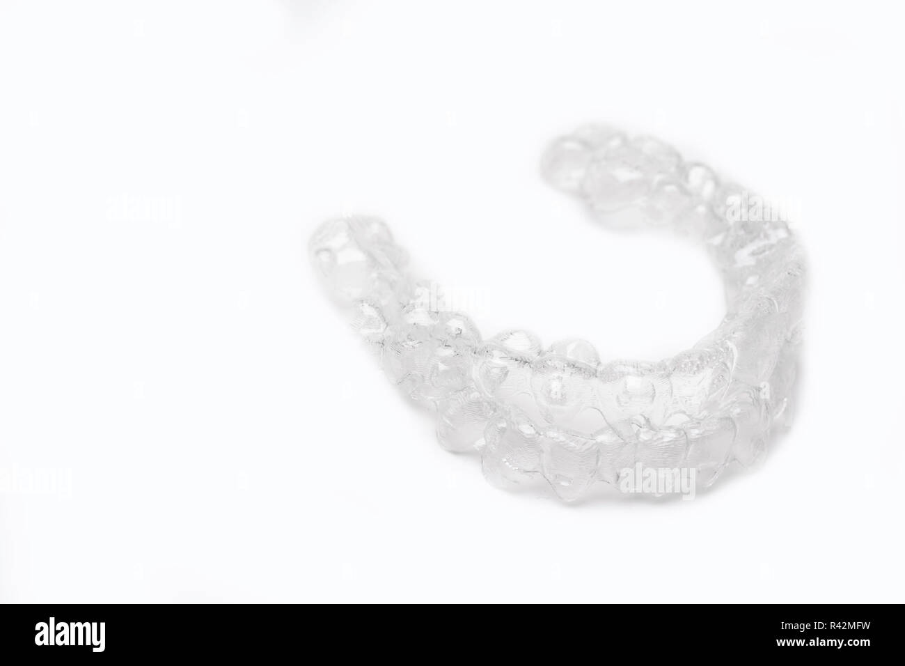 invisible braces or aligner on white background, A way to have a ...