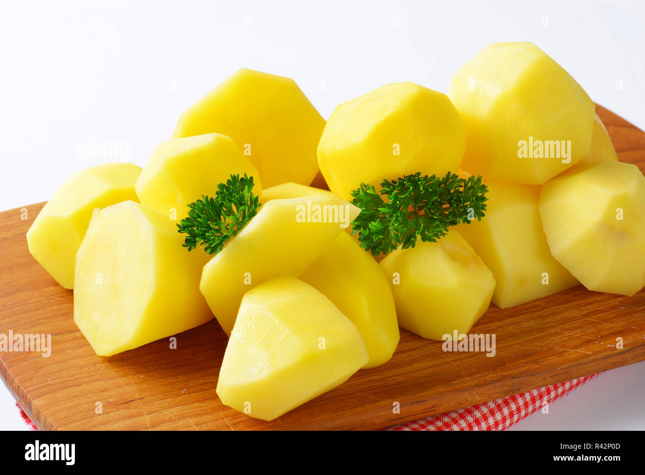 Raw peeled potatoes Stock Photo - Alamy