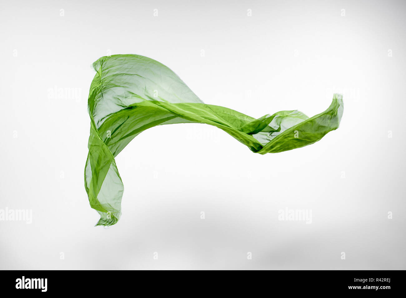 abstract piece of green fabric flying Stock Photo - Alamy