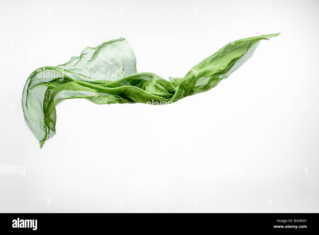 abstract piece of green fabric flying Stock Photo - Alamy