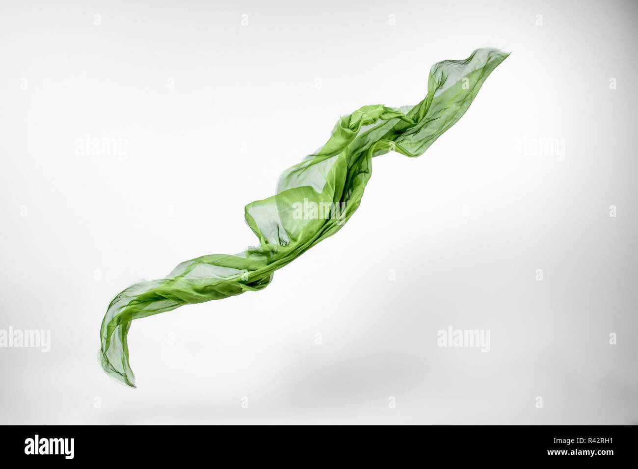 abstract piece of green fabric flying Stock Photo - Alamy