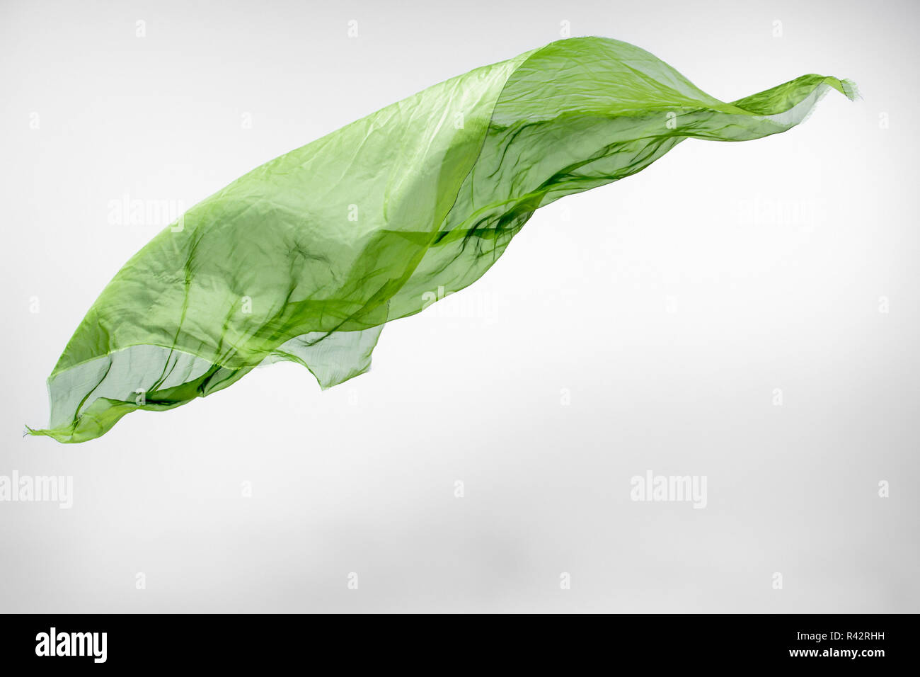 abstract piece of green fabric flying Stock Photo - Alamy