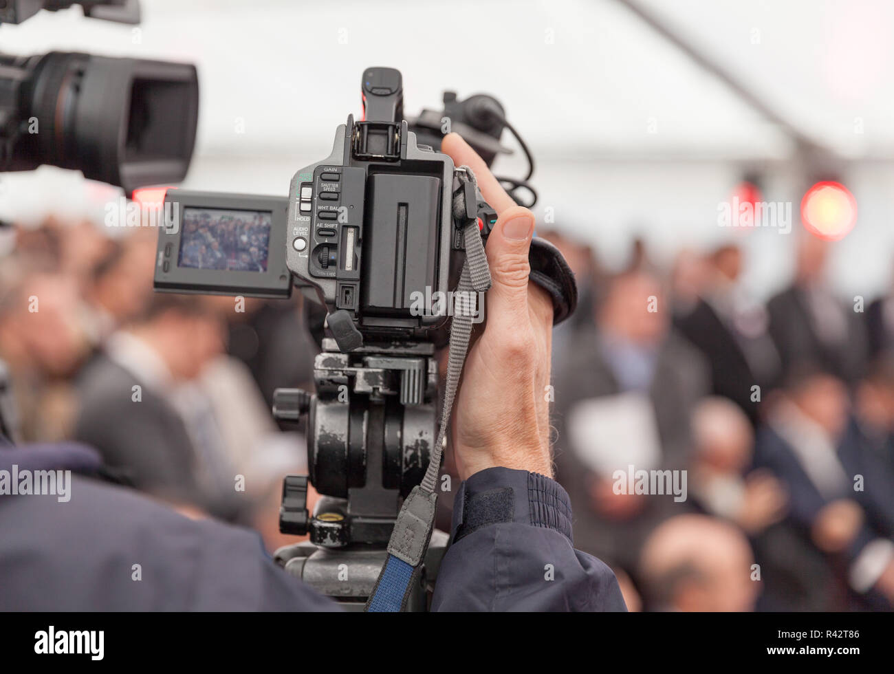 Filming an event with a video camera Stock Photo - Alamy