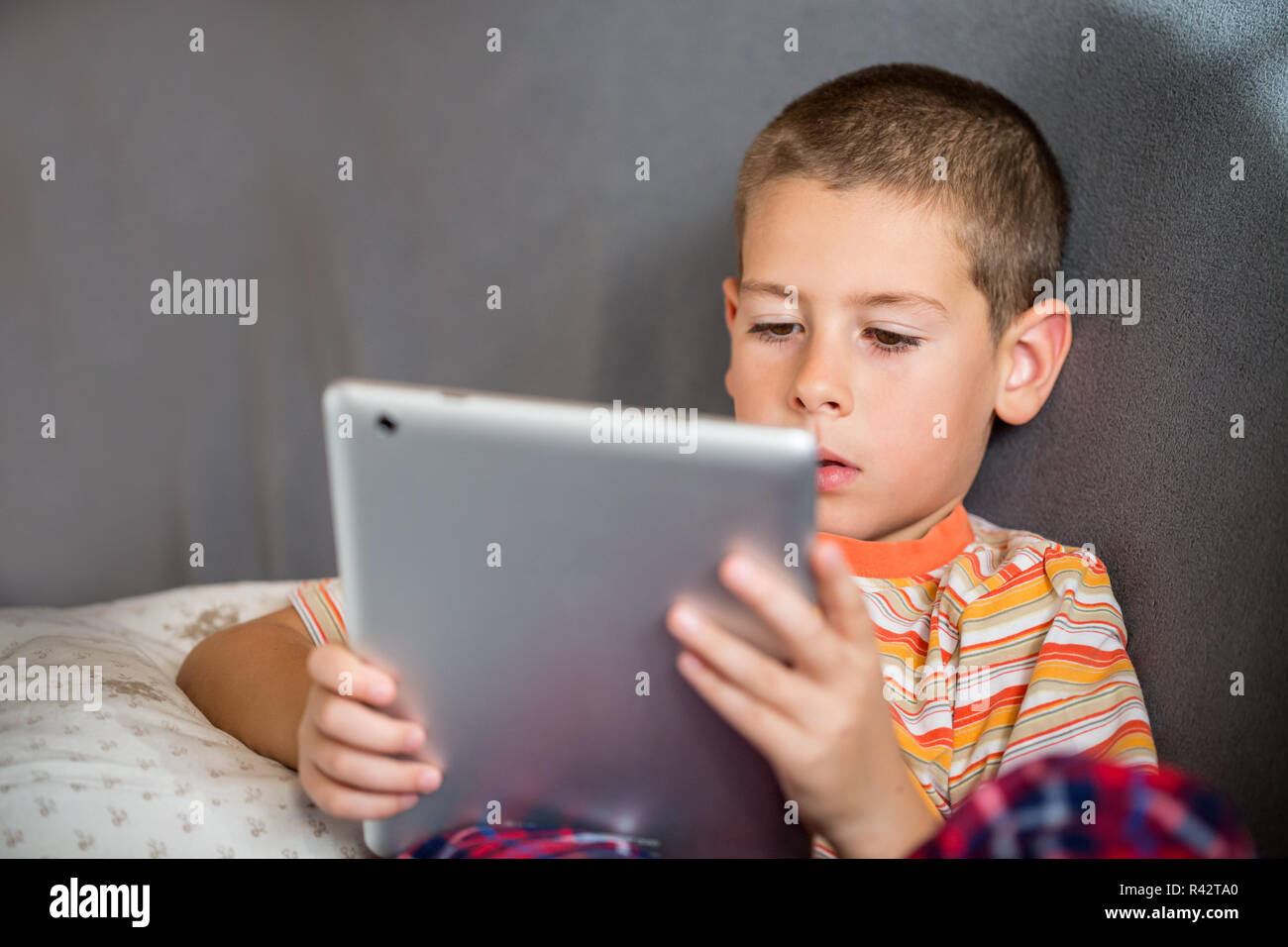 Boy with tablet Stock Photo - Alamy