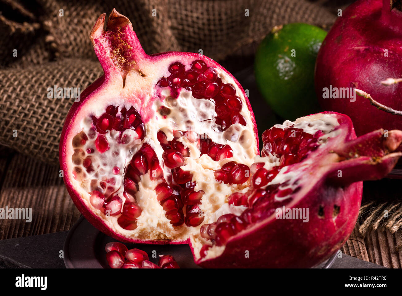 Bright red pomegranate seeds shine hi-res stock photography and images ...