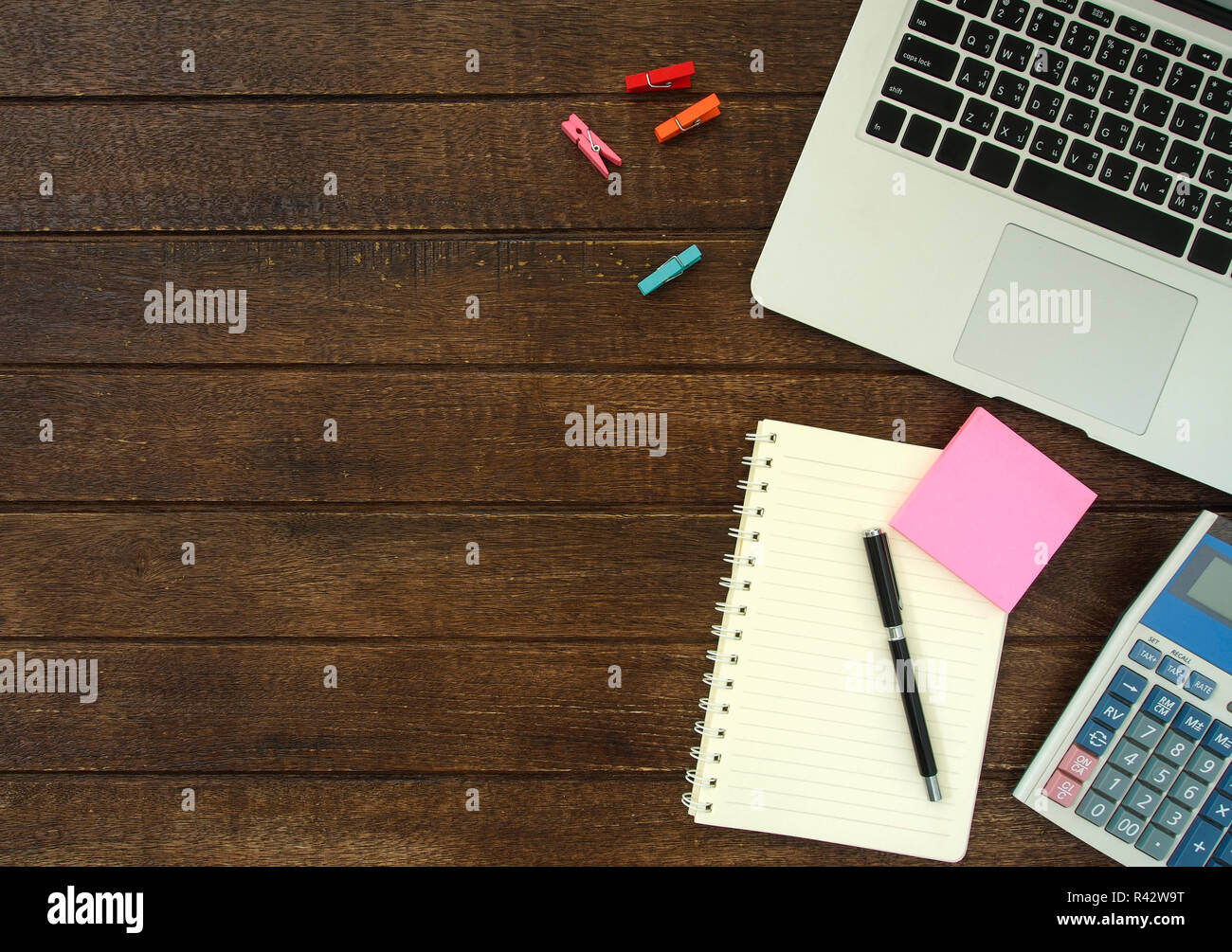 work desk with computer and notebook. View from above Stock Photo - Alamy