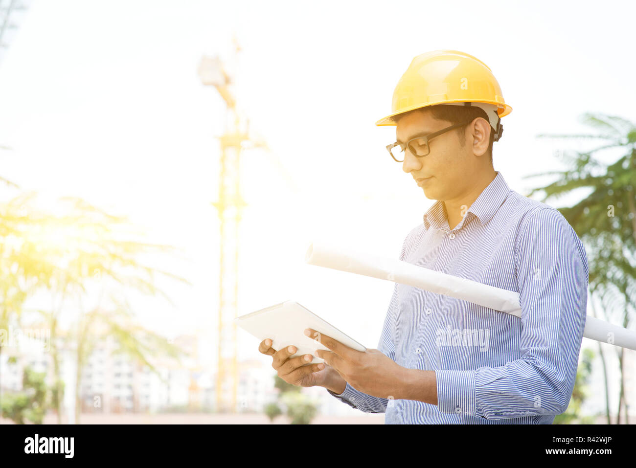 Indian guy reading tablet hi-res stock photography and images - Alamy