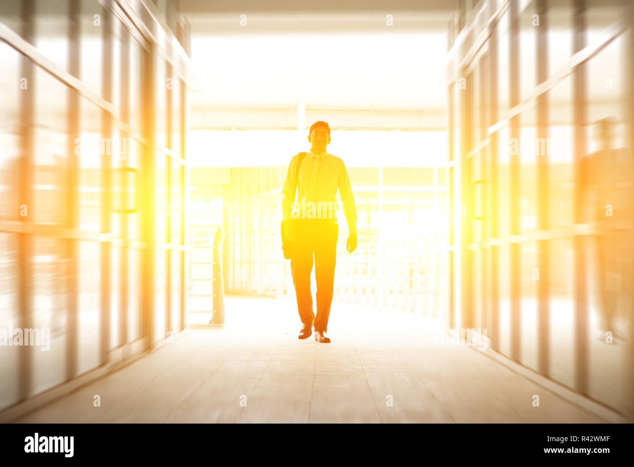 Business people walking thru modern office Stock Photo - Alamy
