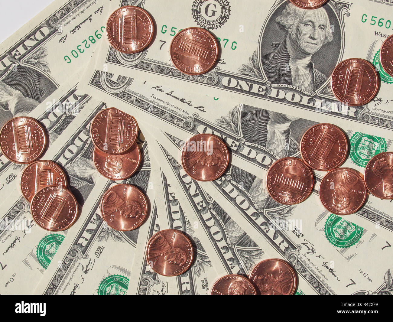 Dollar coins and notes Stock Photo - Alamy