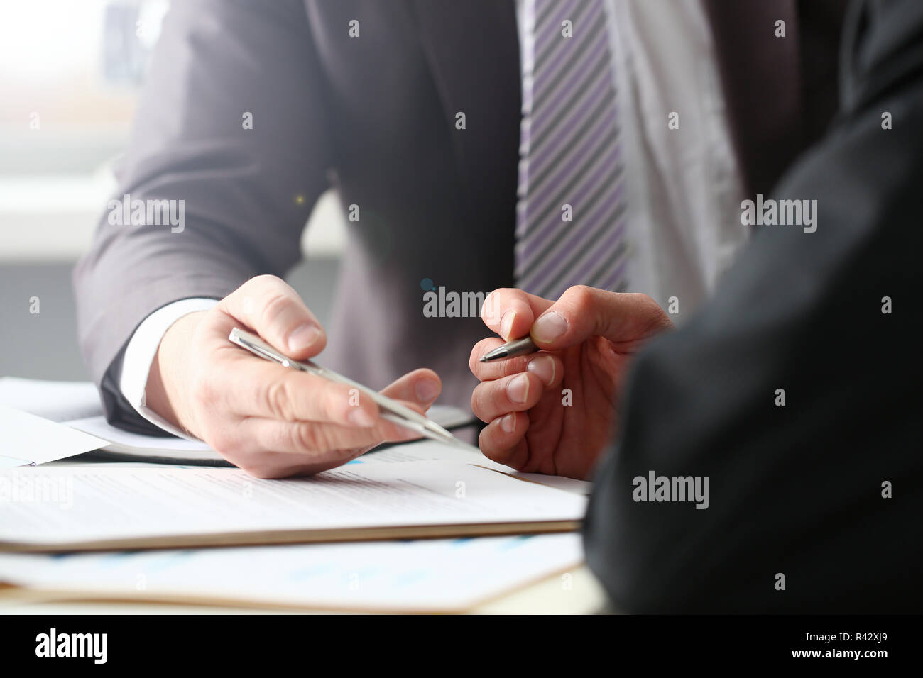 Male arm in suit and tie fill form clipped Stock Photo - Alamy