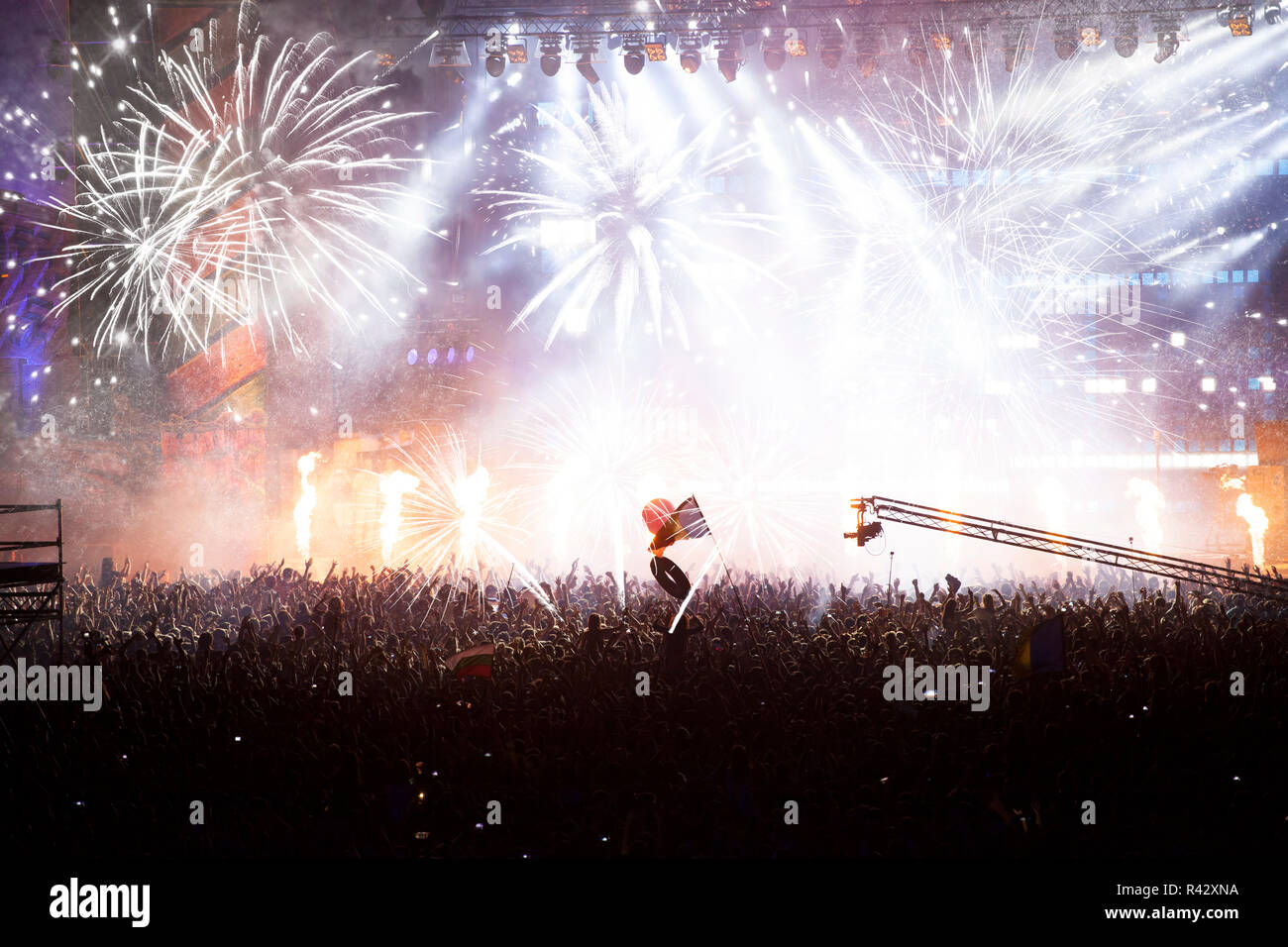 New Year concept - cheering crowd and fireworks Stock Photo - Alamy