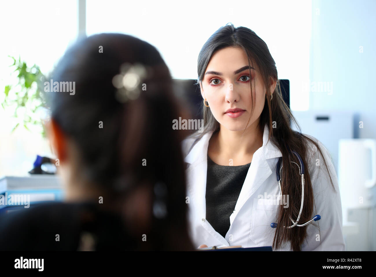 Smiling beautiful female medicine doctor explain diagnosis Stock Photo ...