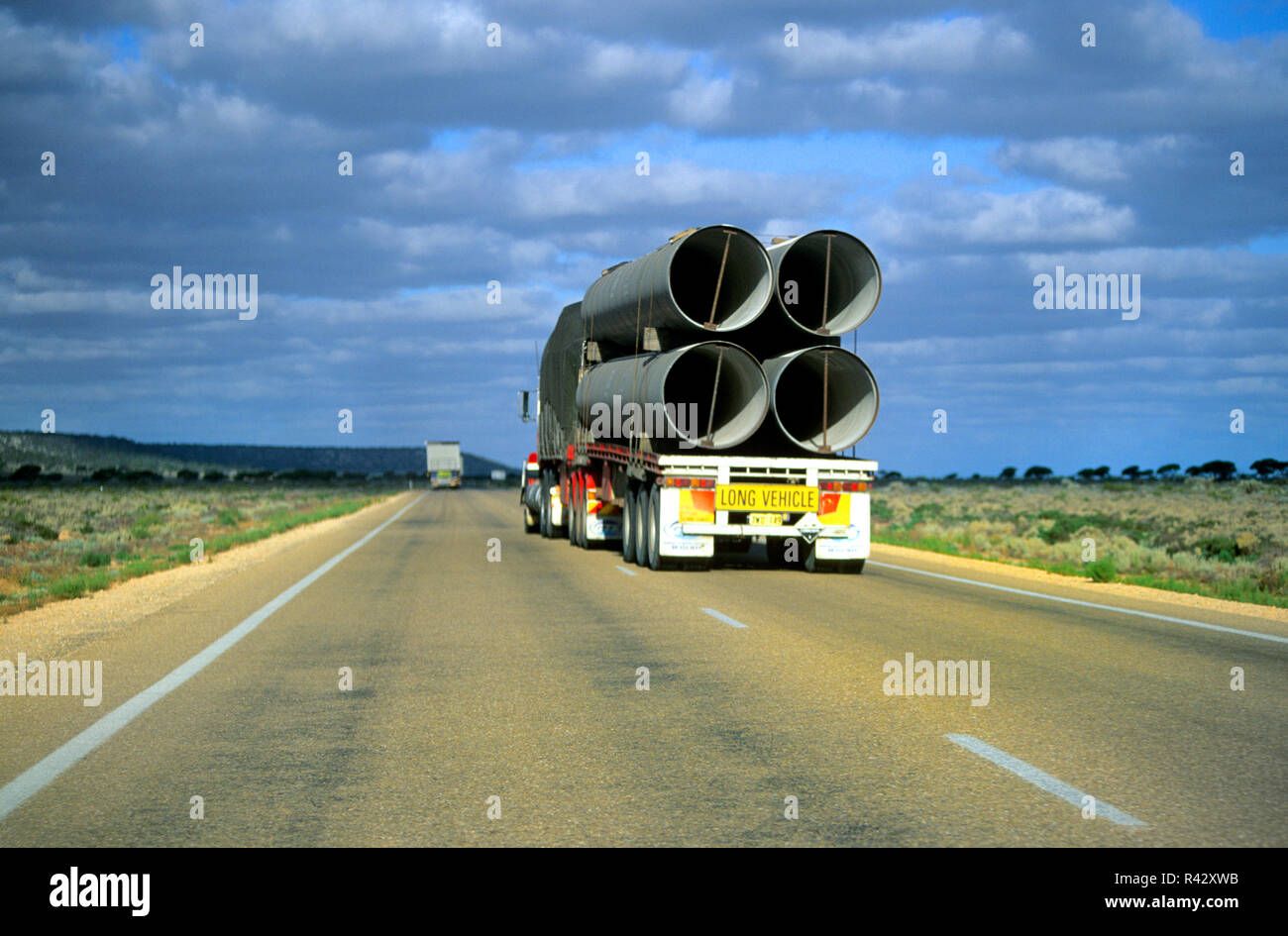 Road train transporting large water pipes, Australia Stock Photo - Alamy